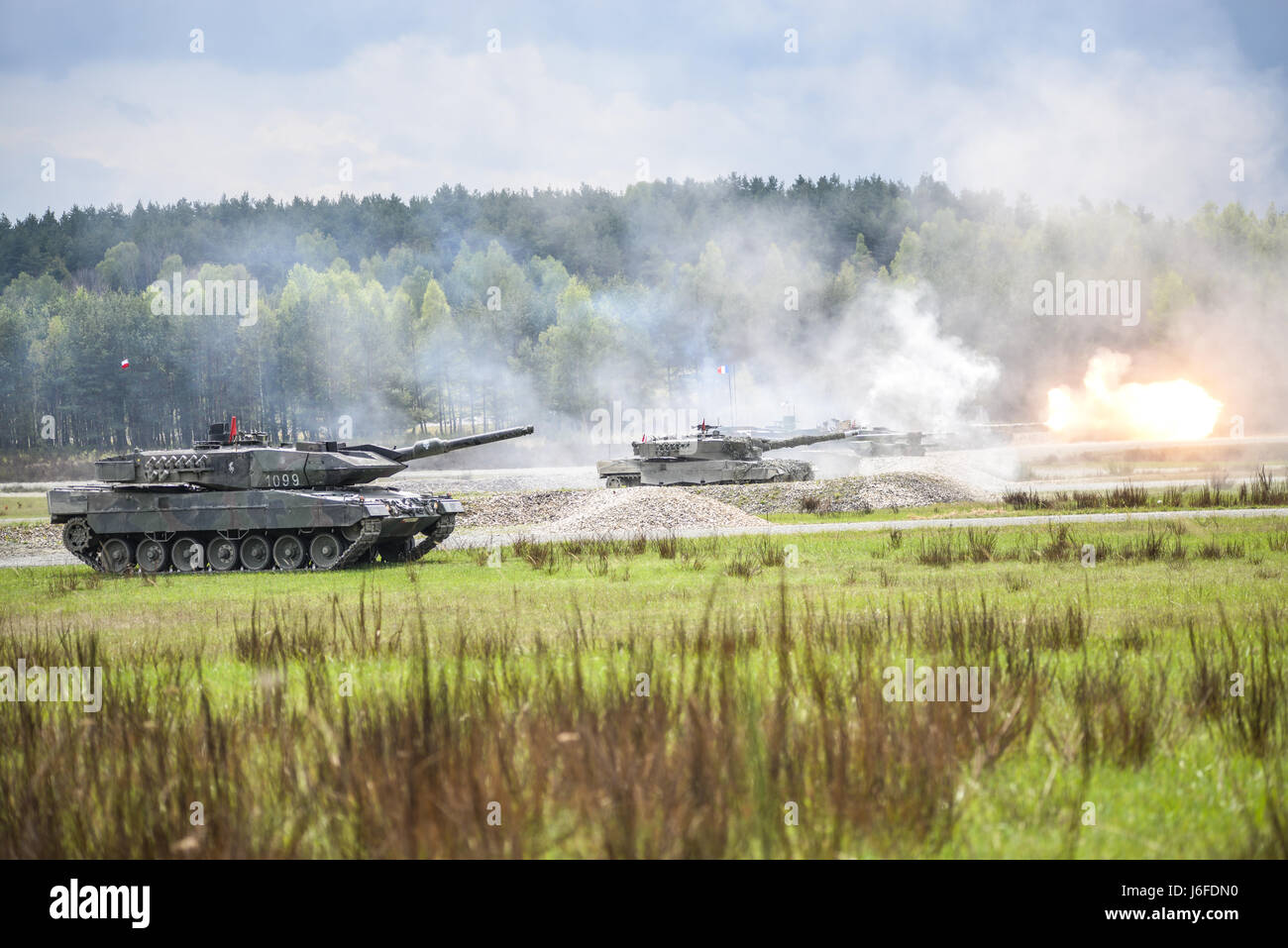 Tanks from six NATO and partner nations fire at their targets during ...