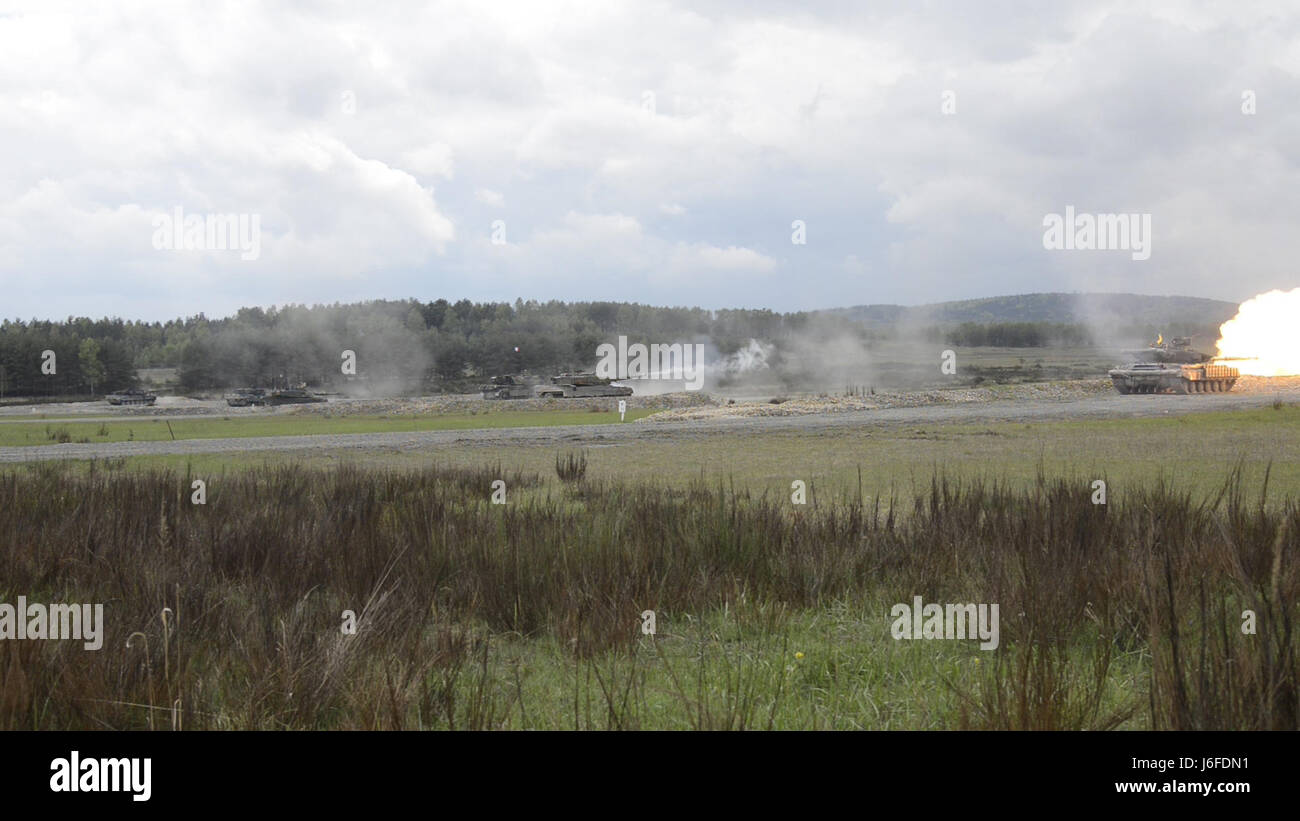 Tanks from six NATO partner nations fire at their targets during the ...