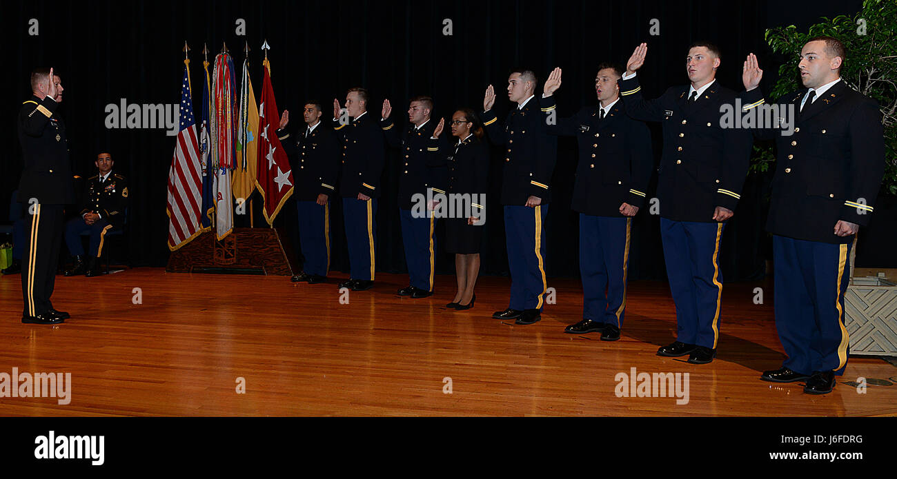 Eight ROTC cadets take the Oath of Office during a Commissioning ...