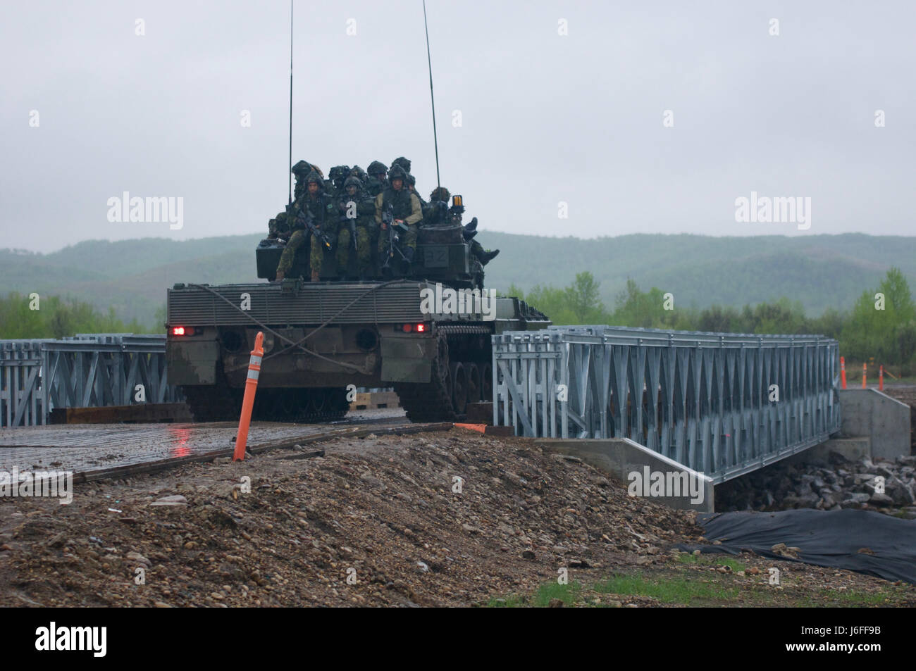 Canadian soldiers of the 2nd Canadian Mechanized Brigade Group move ...