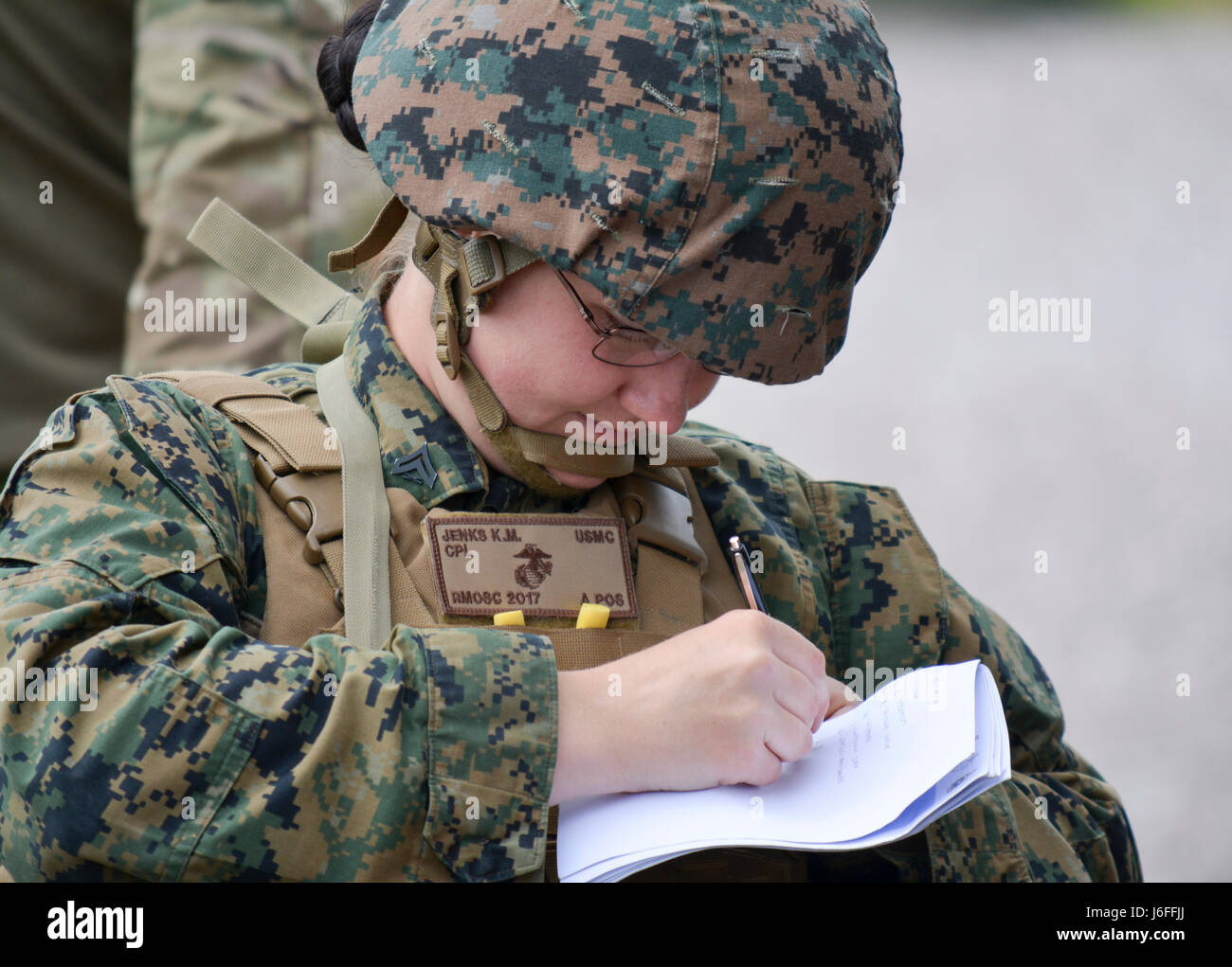 U.S. Marine Corps combat marksmanship coach records data at Range 43 ...