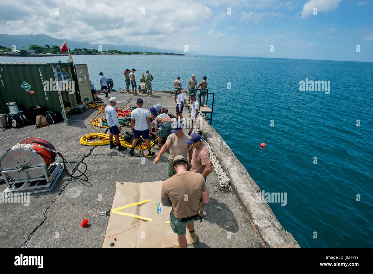 U.S. Sailors assigned to Underwater Construction Team (UCT) 2 and ...