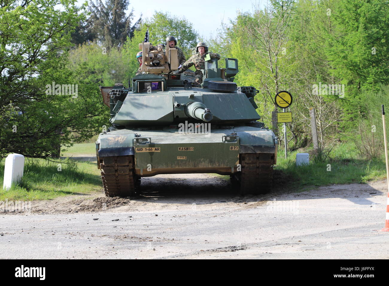 A Danish tank crew member (left) and Spc. Alexander Kefford, a tank ...