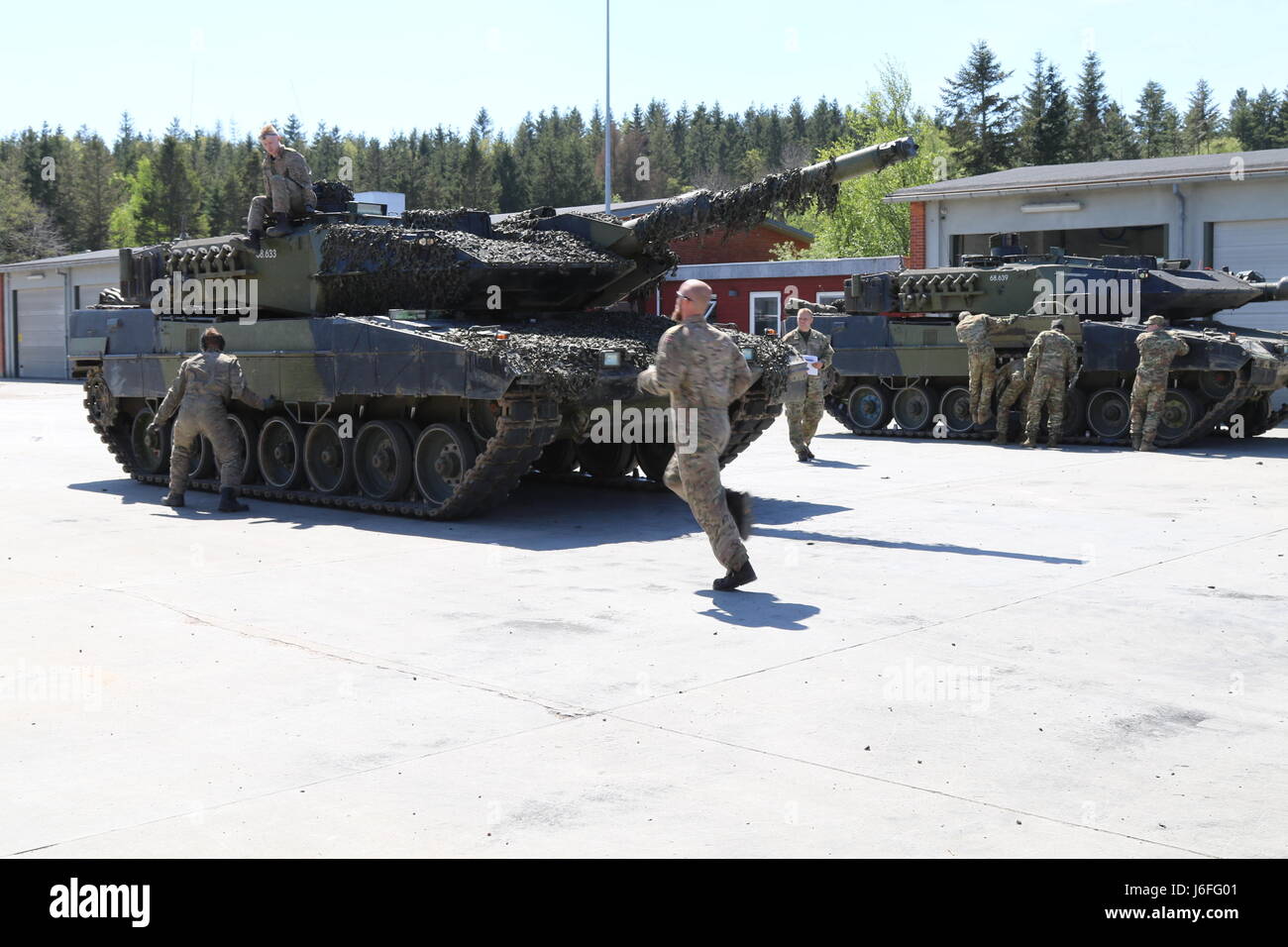 M1A2 Abrams tank crews from Battle Company, 1st Battalion, 66th Armor ...