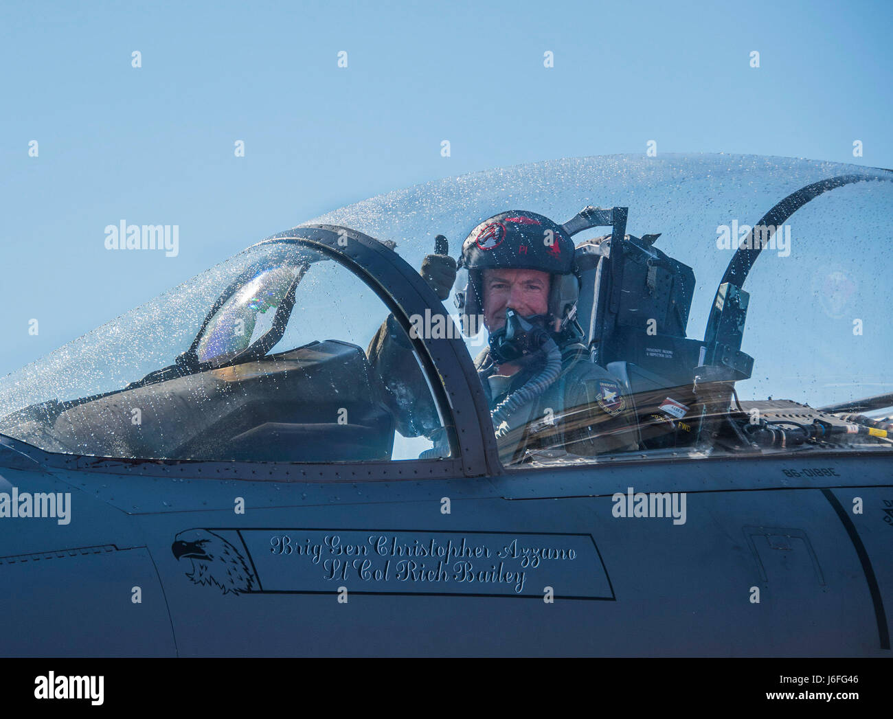 The 96th Test Wing commander signals aircraft maintainers during his ...