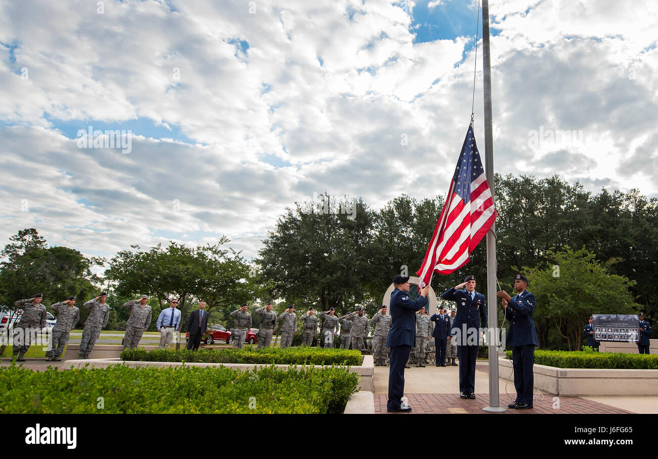 Salutes are rendered as the American Flag is raised at the All Wars ...