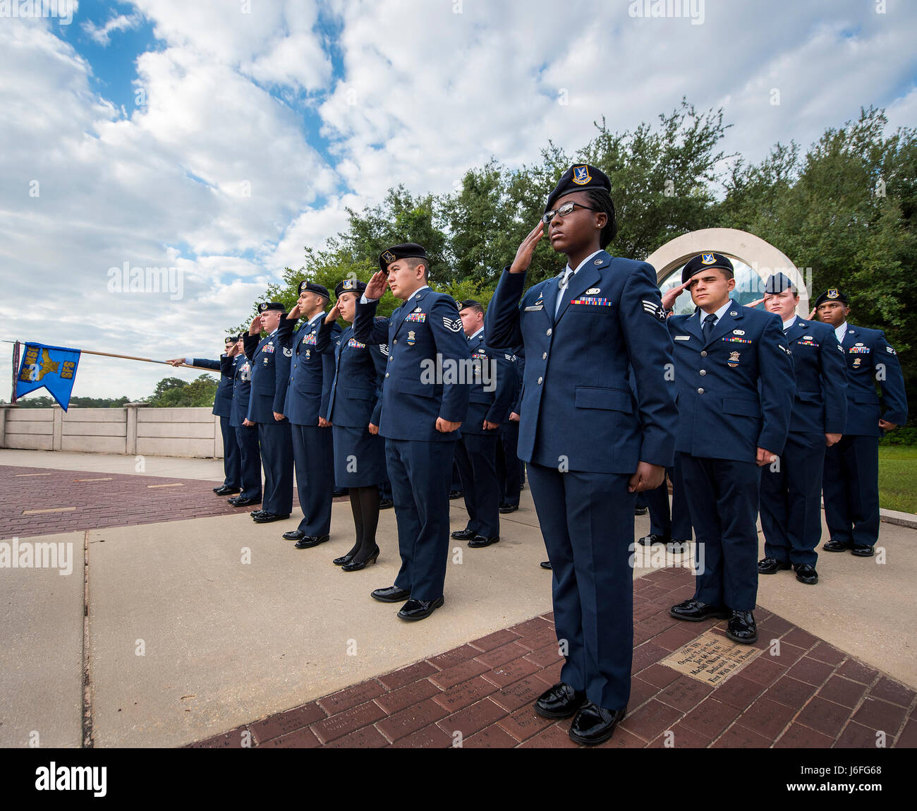 A formation of 96th Security Forces Squadron Airmen salute during the ...