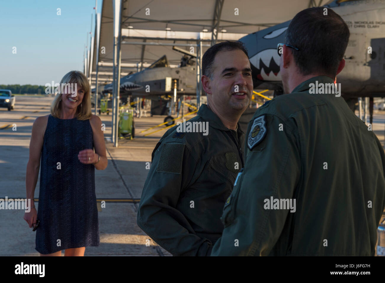 Col. Mark Barrera, 23d Wing vice commander, embraces Lt. Col. Sean Hall ...