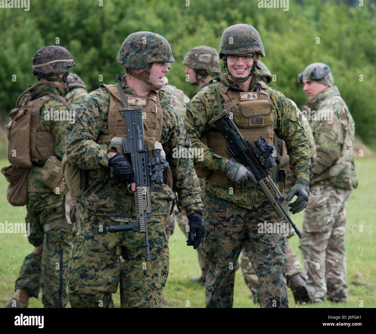 U.S. Marine Corps Staff Sgt. Matthew Tarkey, left, chief foreign ...