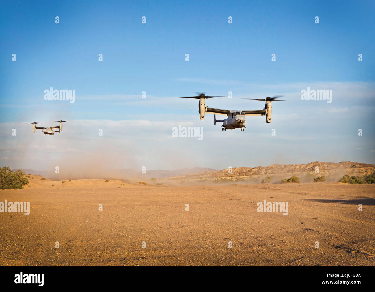 MV-22 Ospreys from VMM-363 perform a flyover following tail gun ...