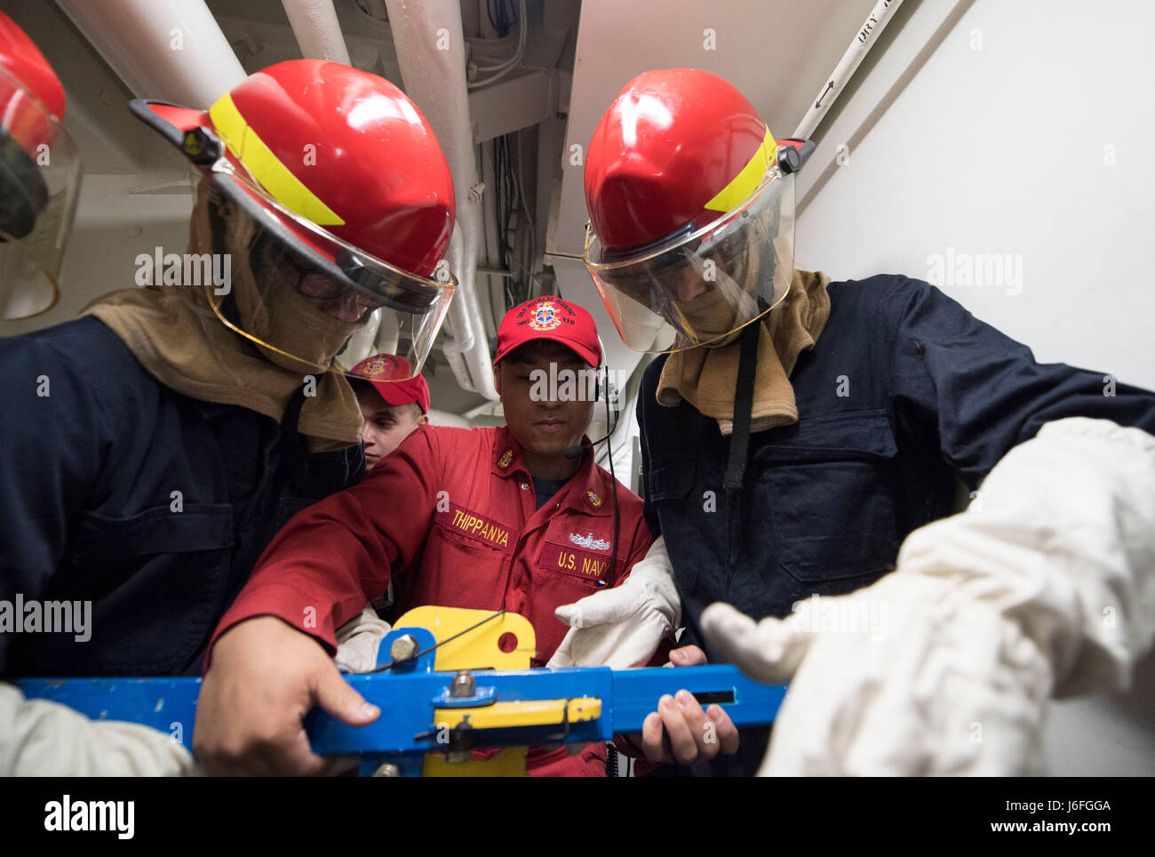 Sailors aboard USS Michael Murphy (DDG 112) install metal shoring ...