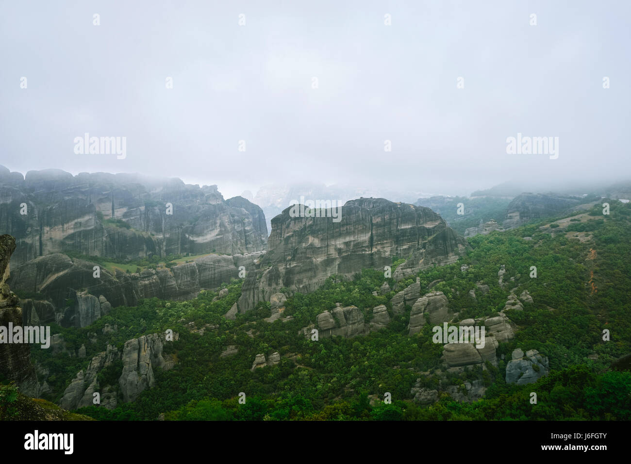 Fog landscape of Meteora Rocks , Greece Stock Photo - Alamy