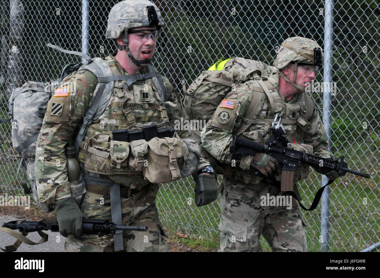 Soldiers cross the finish line in a ruck march as part of the I Corps ...