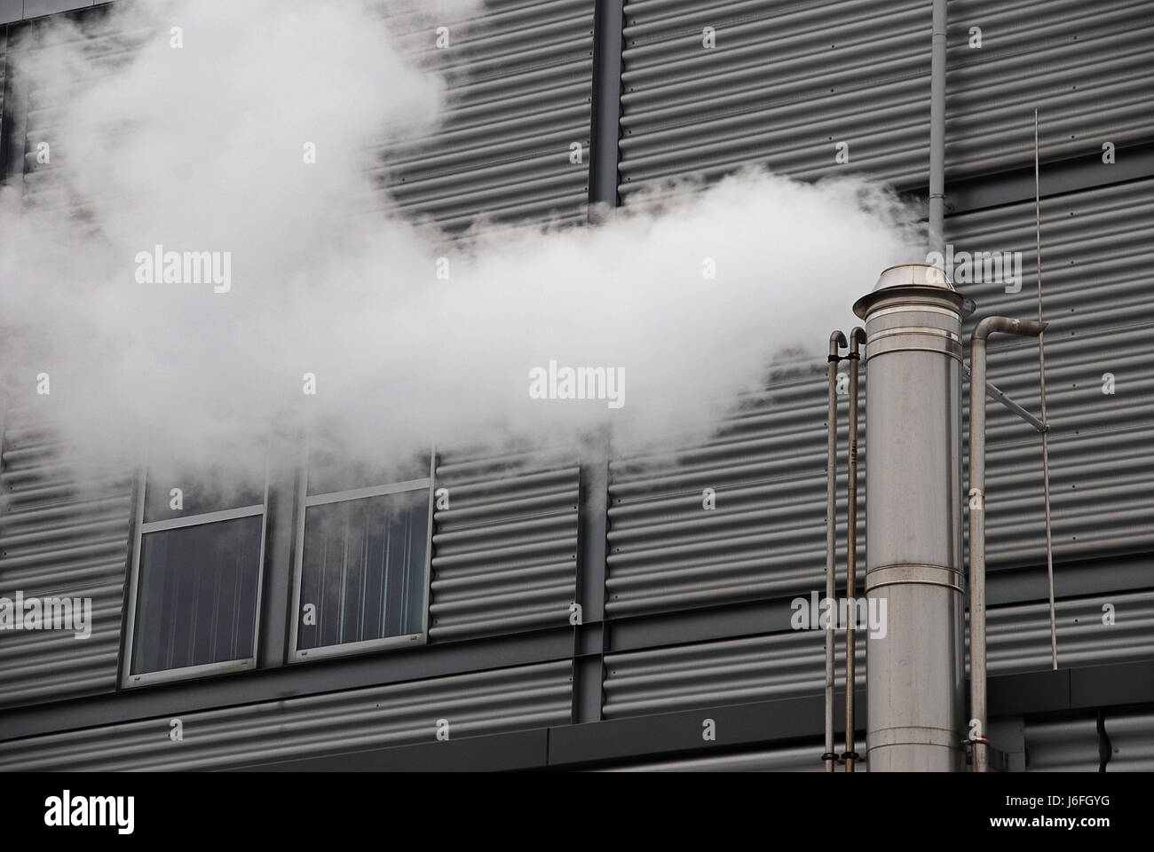 smoke smoking smokes fume metal work factory hydrogen factory building ...