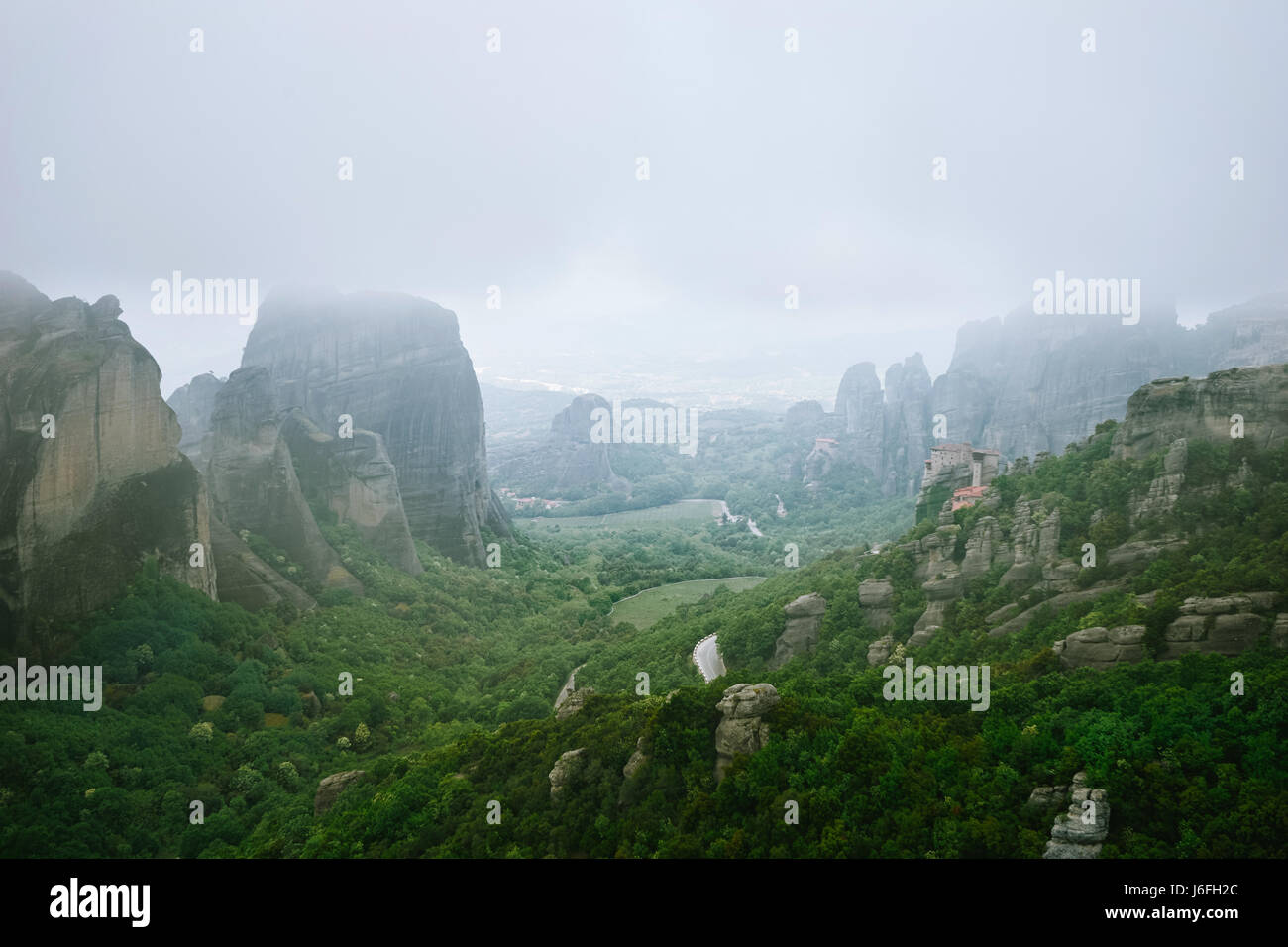 Fog landscape of Meteora Rocks , Greece Stock Photo - Alamy