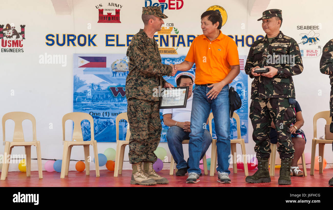 U.S. Marine Lt. Col. Ryan E. Scott, left, commanding officer, 9th ...