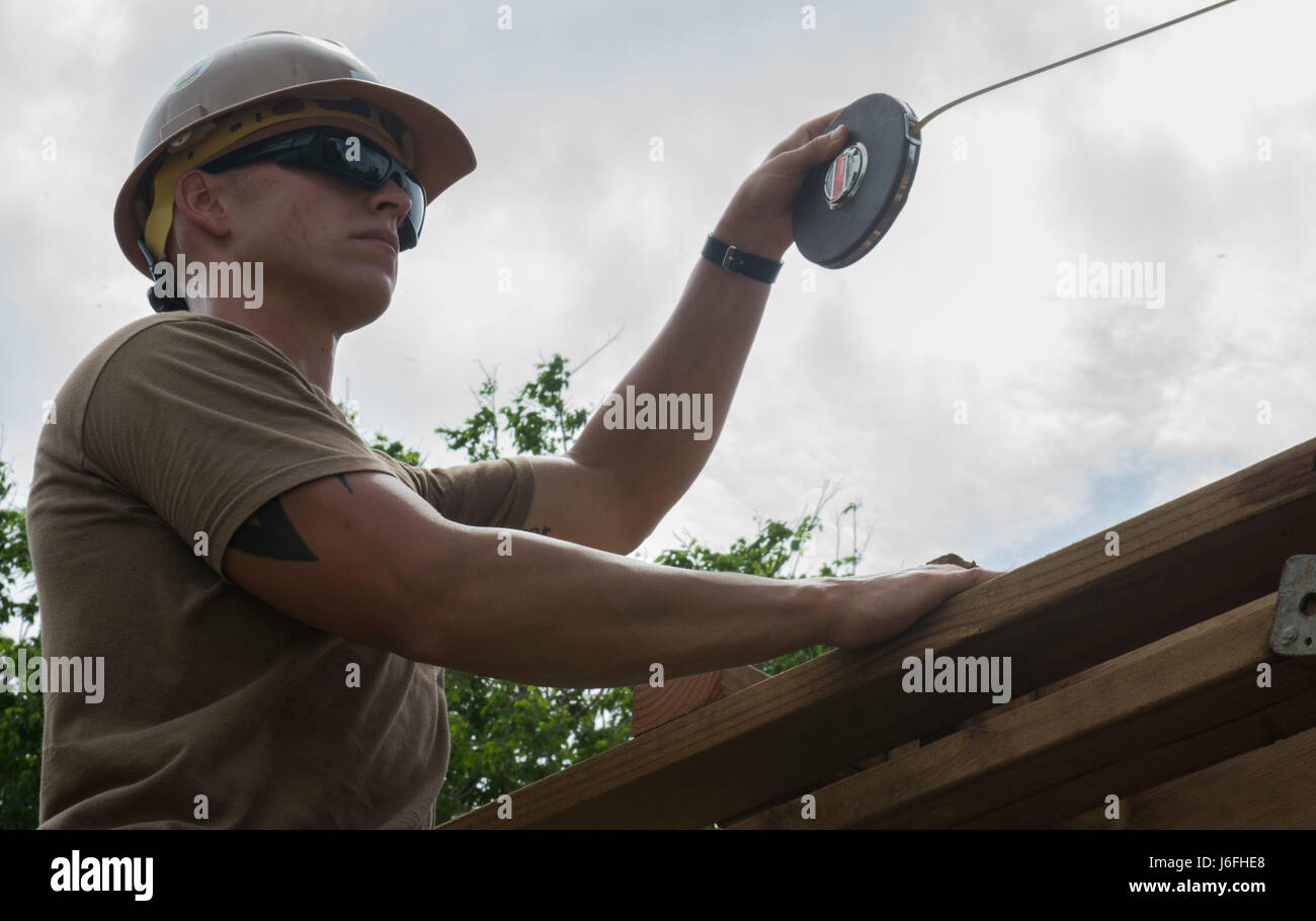 Builder 1st Class Adam Merrill, assigned to Naval Mobile Construction ...