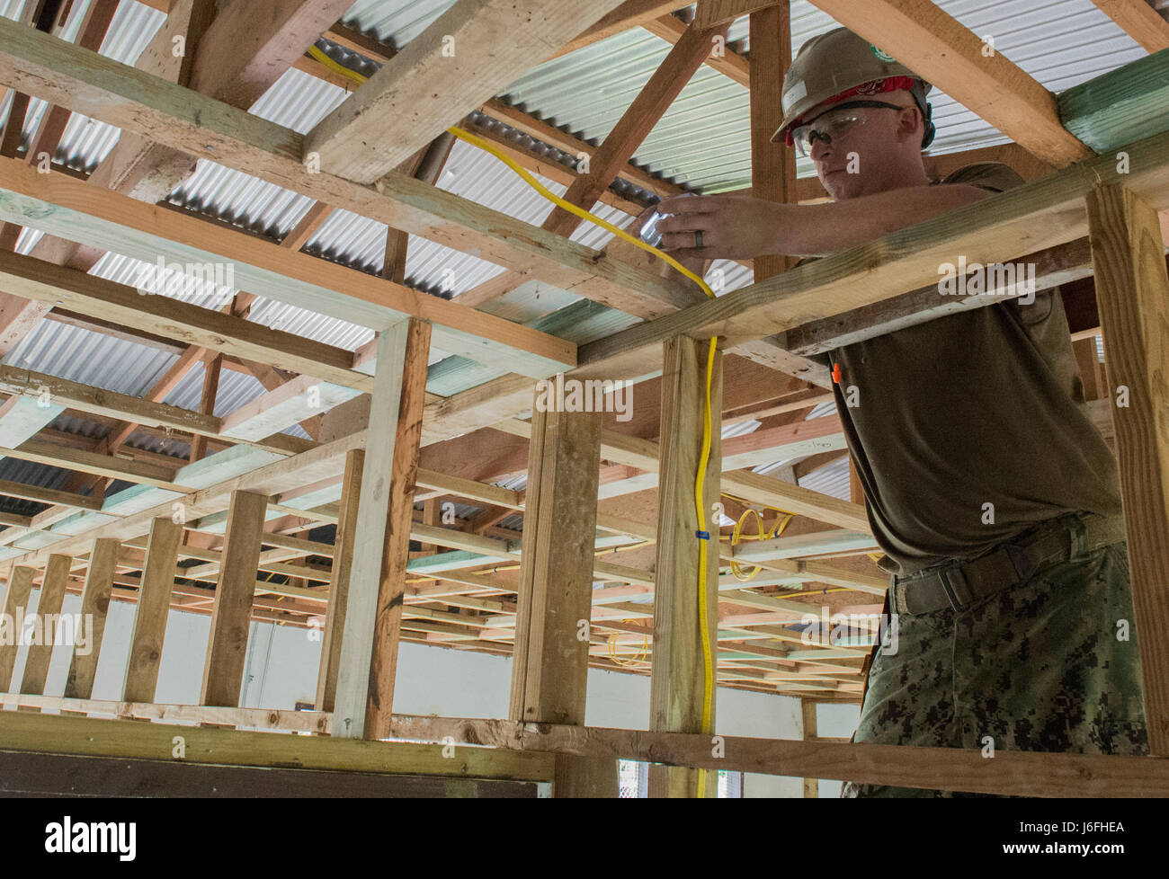 Steelworker 3rd Class Austin Cox, assigned to Naval Mobile Construction ...