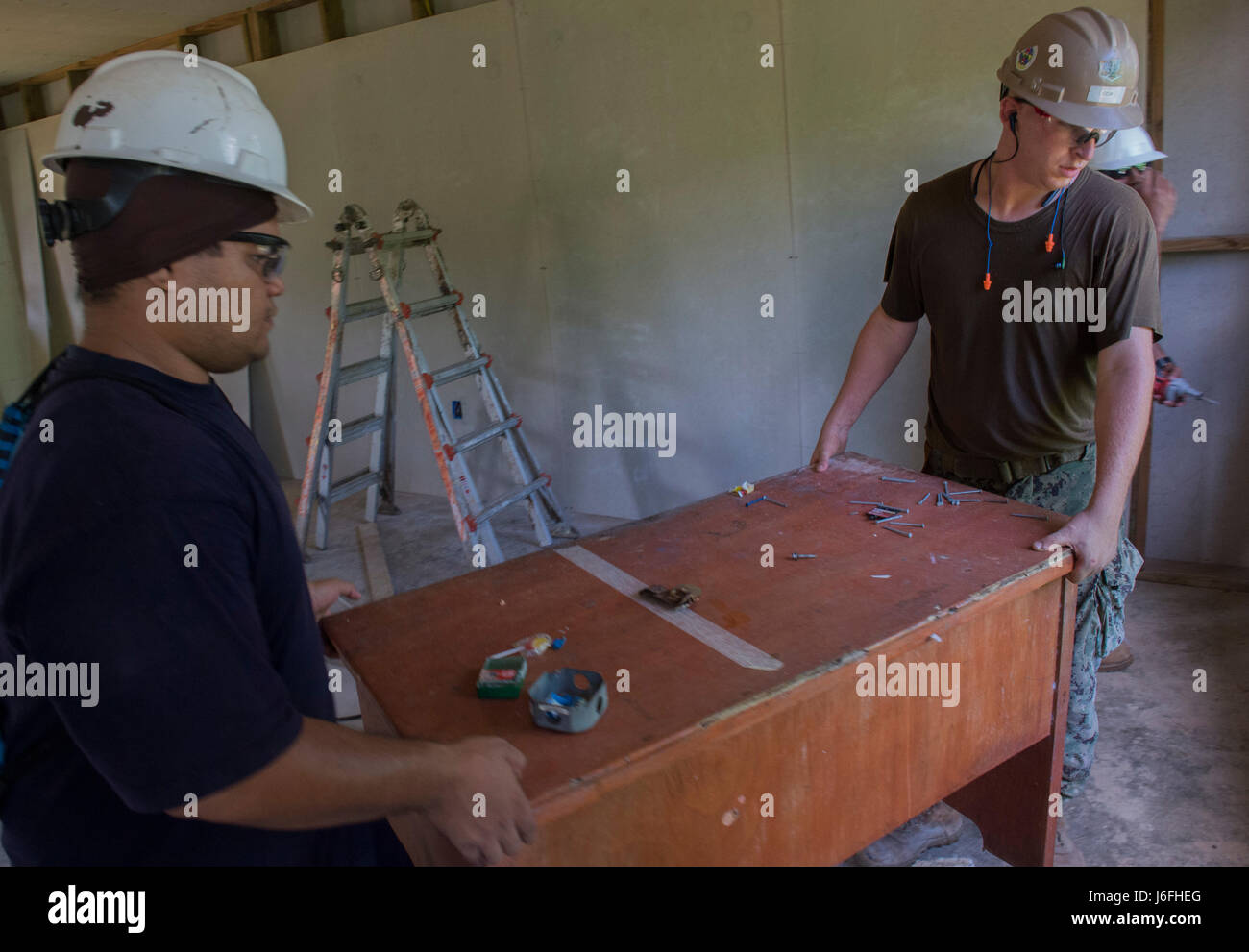 Steelworker 3rd Class Austin Cox, assigned to Naval Mobile Construction ...