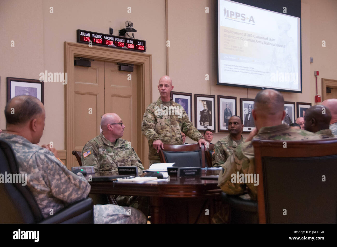 Colonel James (Darby) McNulty (standing), Project and Program Manger ...