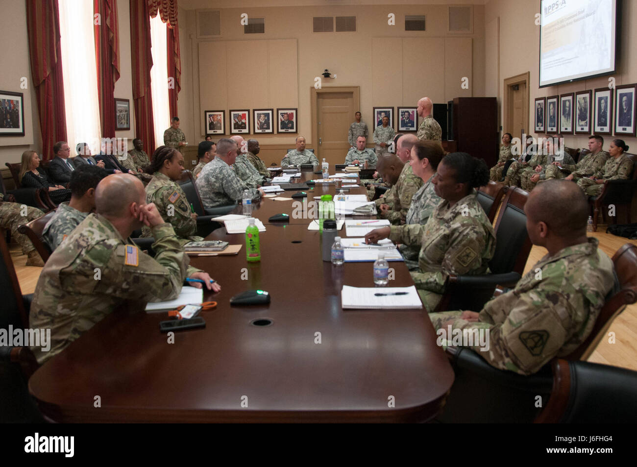 Colonel James (Darby) McNulty (standing), Project and Program Manger ...