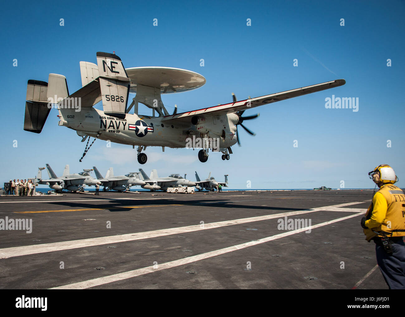 An E-2C Hawkeye from Carrier Airborne Early Warning Squadron 113 lands ...