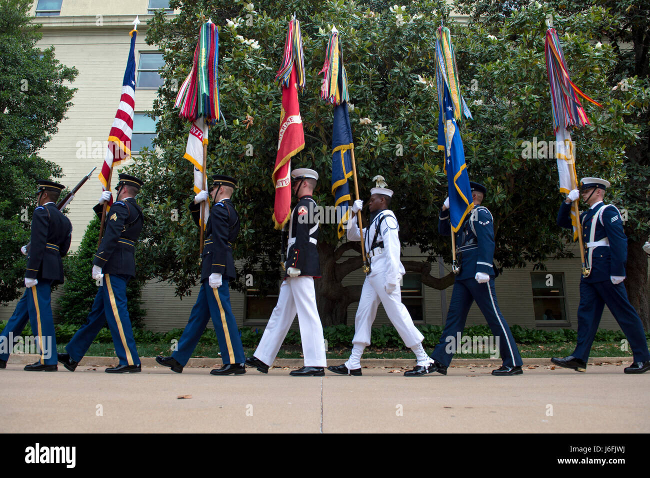A joint service Color Guard marches for the opening ceremony of the ...