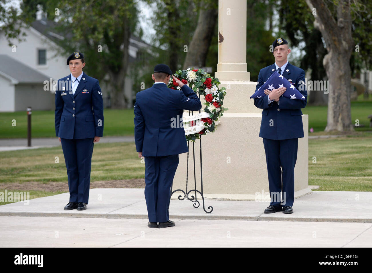 Airman Colin Coffman, 75th Security Forces Squadron, salutes a wreath ...