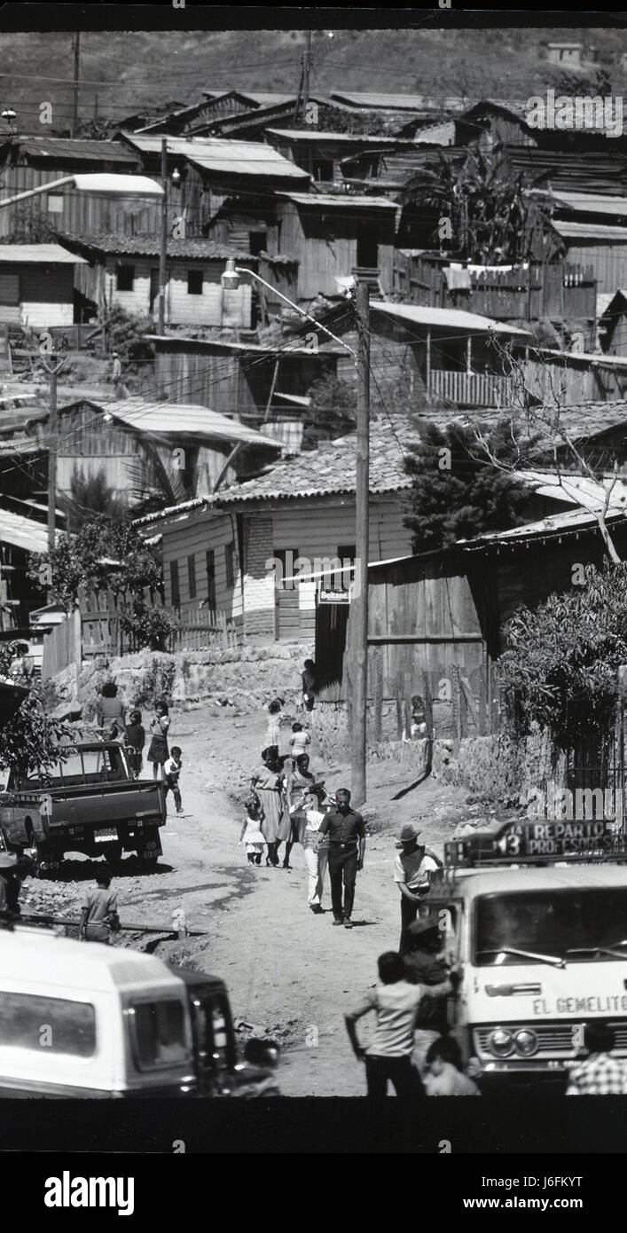 Civilians walk along a village road, illustrating daily life, community ...