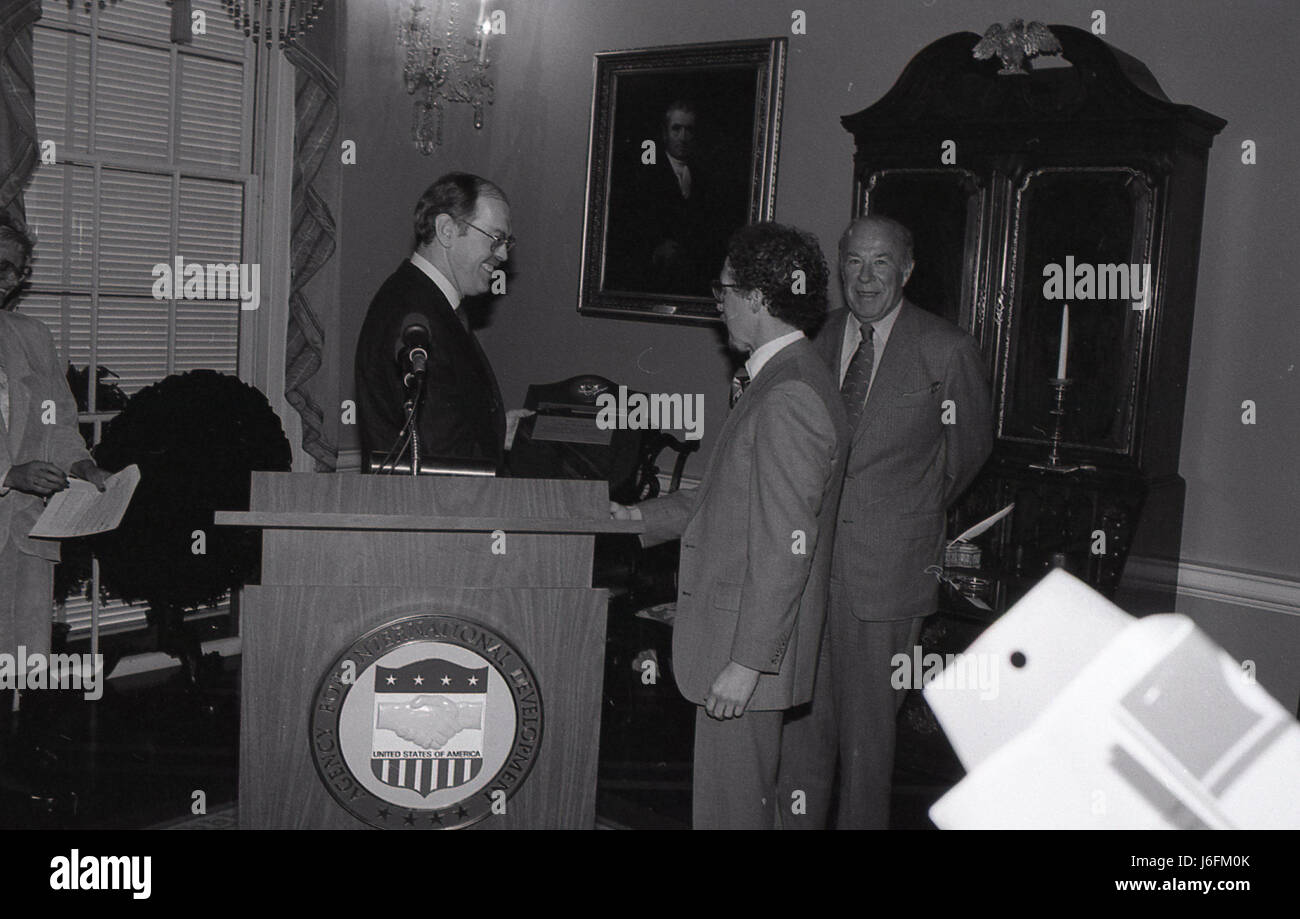MAN GREETING ANOTHER MAN AT THE PODIUM Stock Photo - Alamy