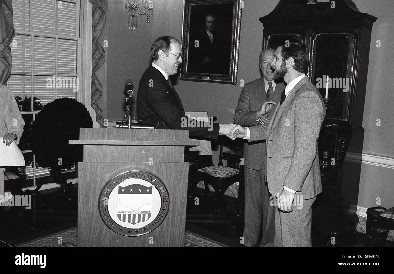 MAN GREETING ANOTHER MAN AT THE PODIUM Stock Photo - Alamy