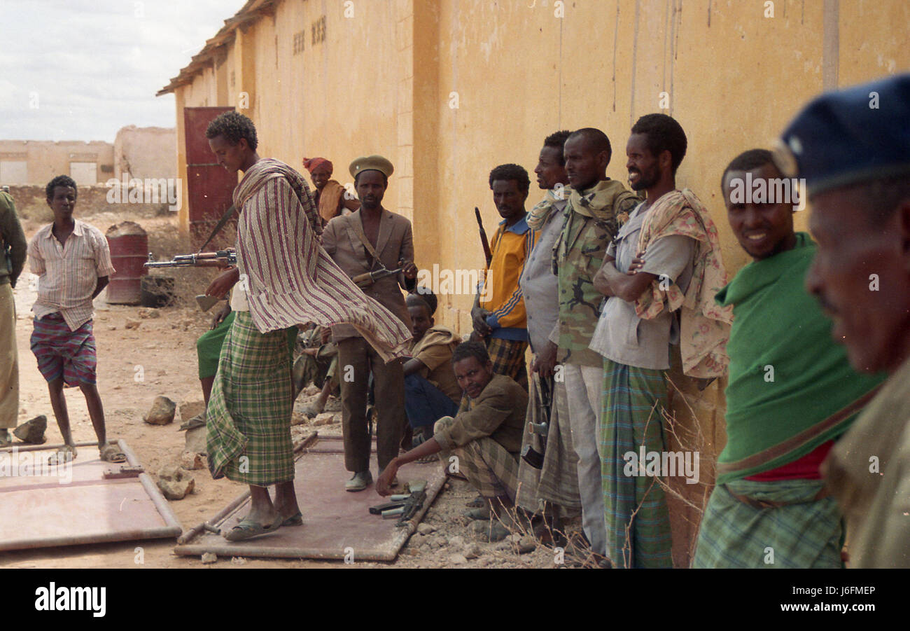 MEN STANDING IN LINE WITH GUNS Stock Photo - Alamy