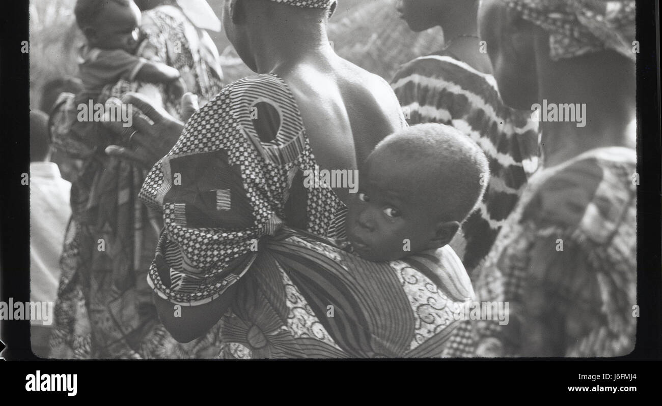 baby on back of mother Stock Photo - Alamy