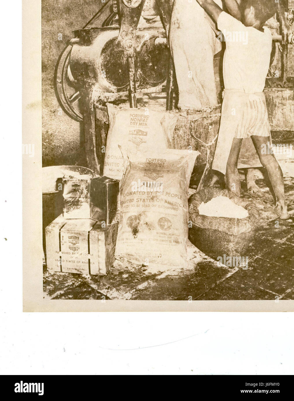 A LITTLE BOY WORKING IN A FACTORY Stock Photo - Alamy