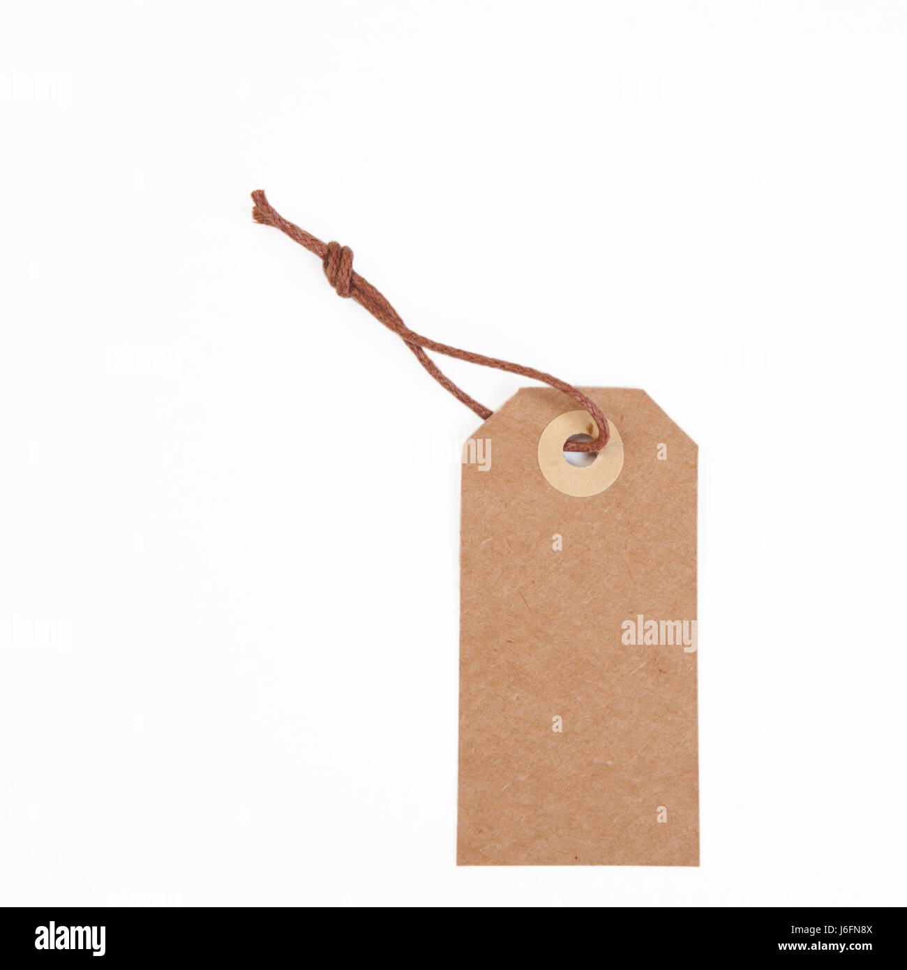 Blank white tag with string on white background Stock Photo - Alamy