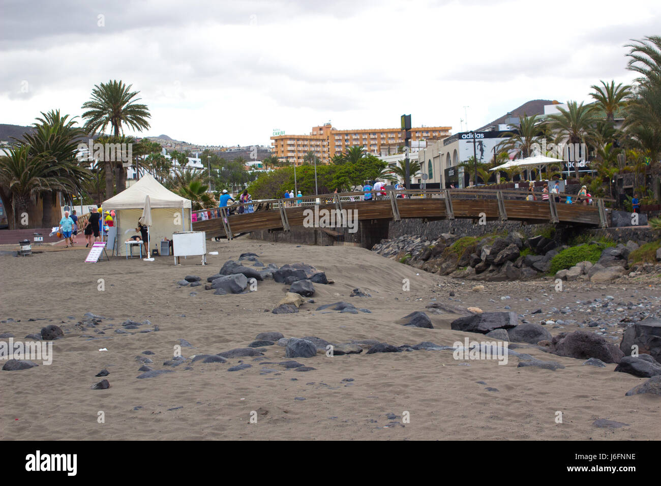A footbridge across the dry river bed and fllood defense channel in ...