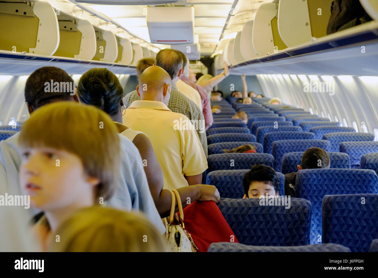 Overhead compartment hi-res stock photography and images - Alamy