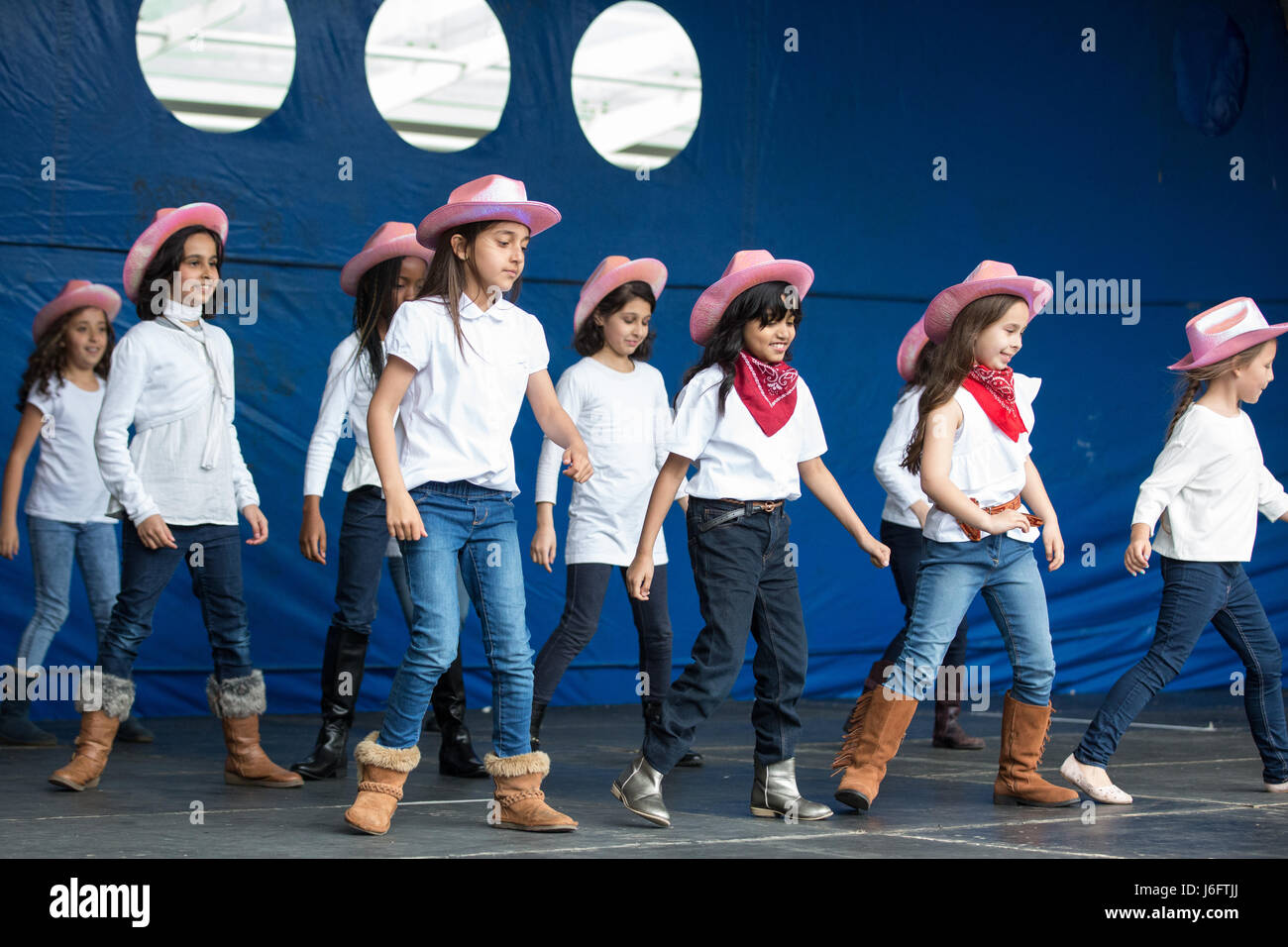 Slough, UK. 20th May, 2017. Western House Academy perform line dances ...