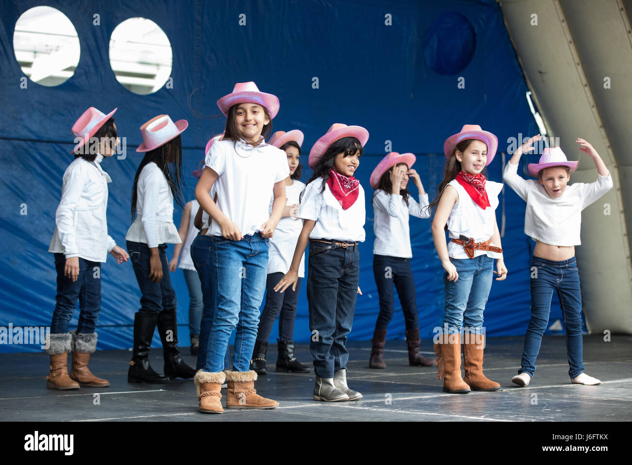 Slough, UK. 20th May, 2017. Western House Academy perform line dances ...