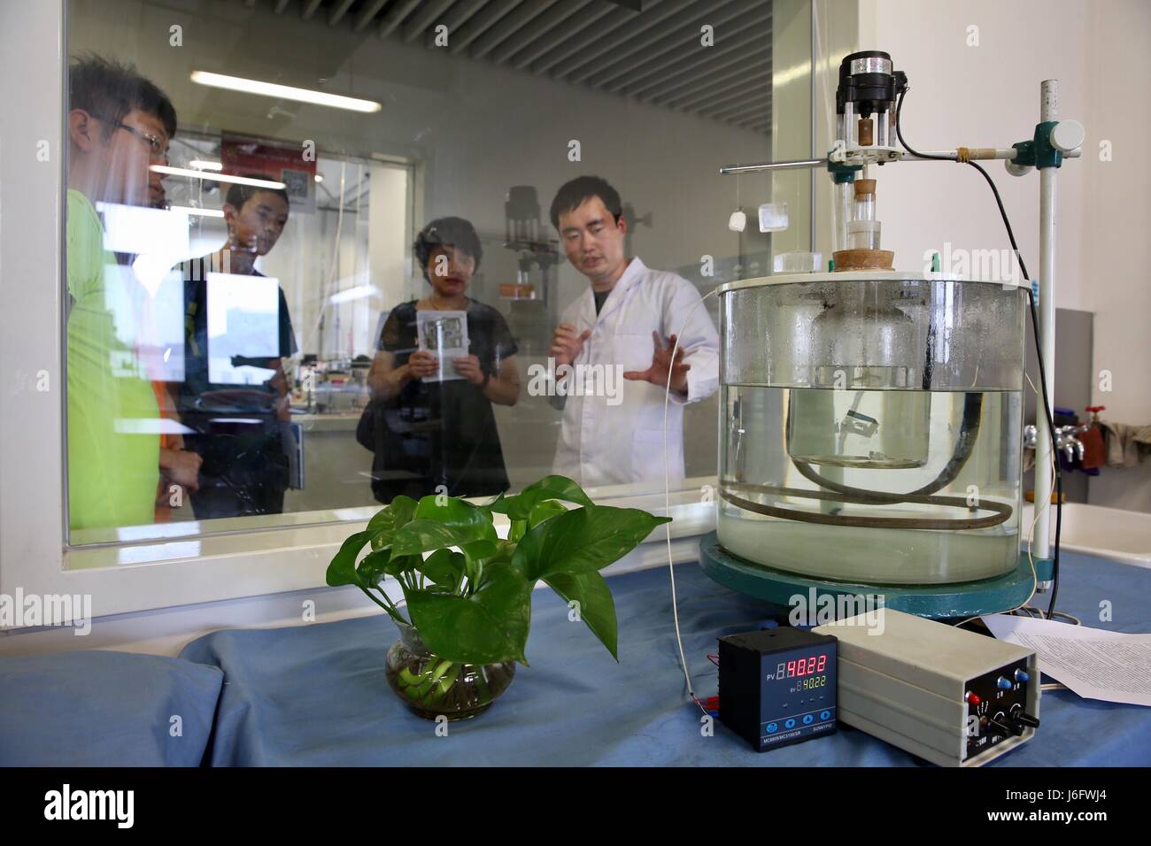Beijing, China. 20th May, 2017. A researcher introduces the growing ...