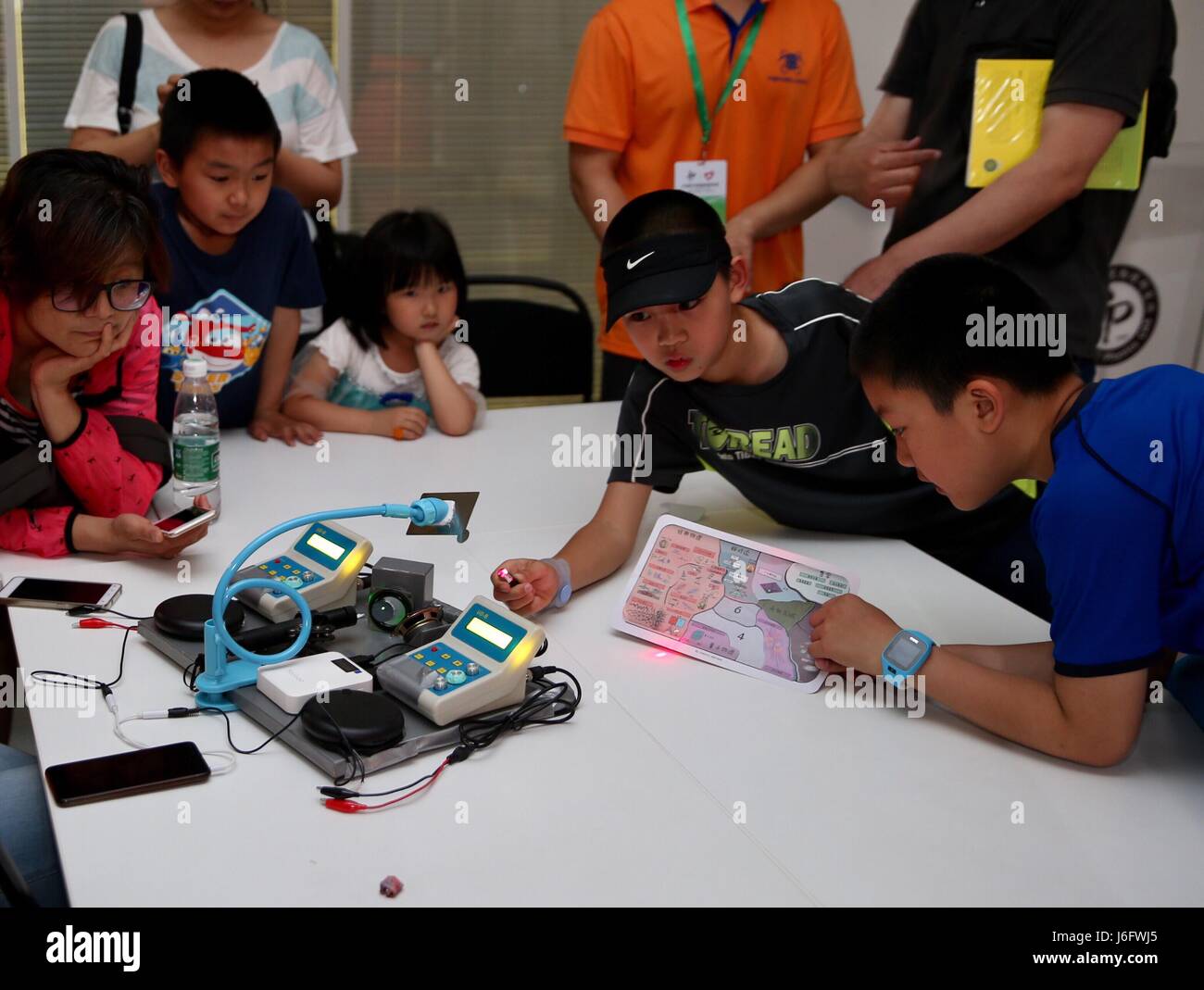 Beijing, China. 20th May, 2017. Children participate in an experiment ...
