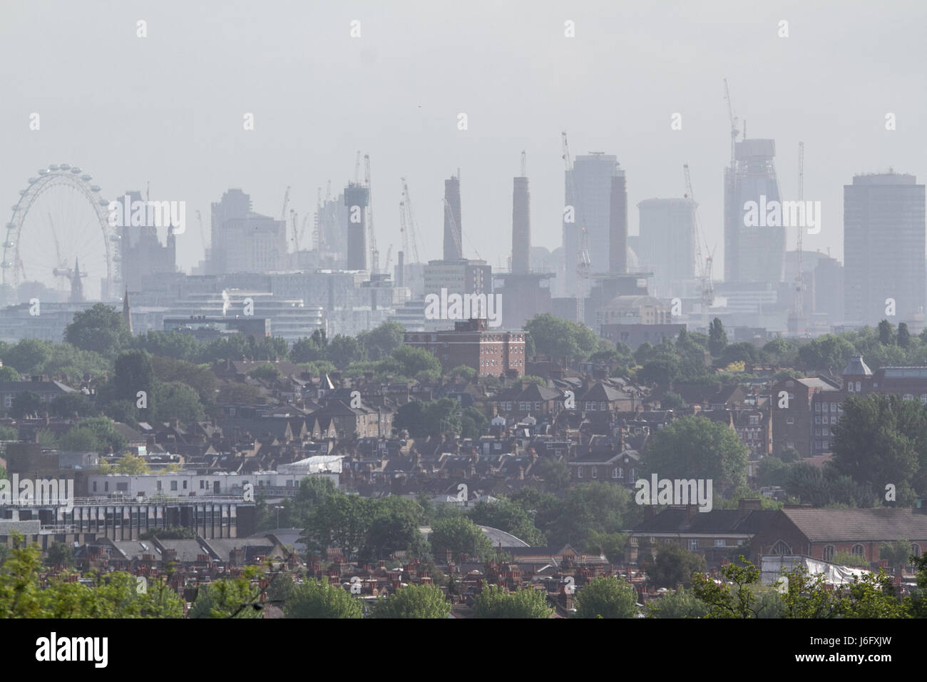 London, UK. 21st May, 2017. London skyline seen from Wimbledon bathed ...
