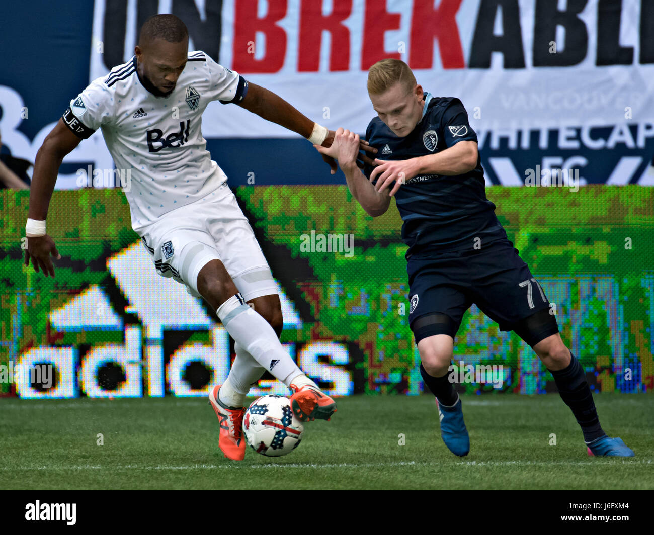 Vancouver. 21st May, 2017. Sporting Kansas City's Tyler Pasher (R) and ...