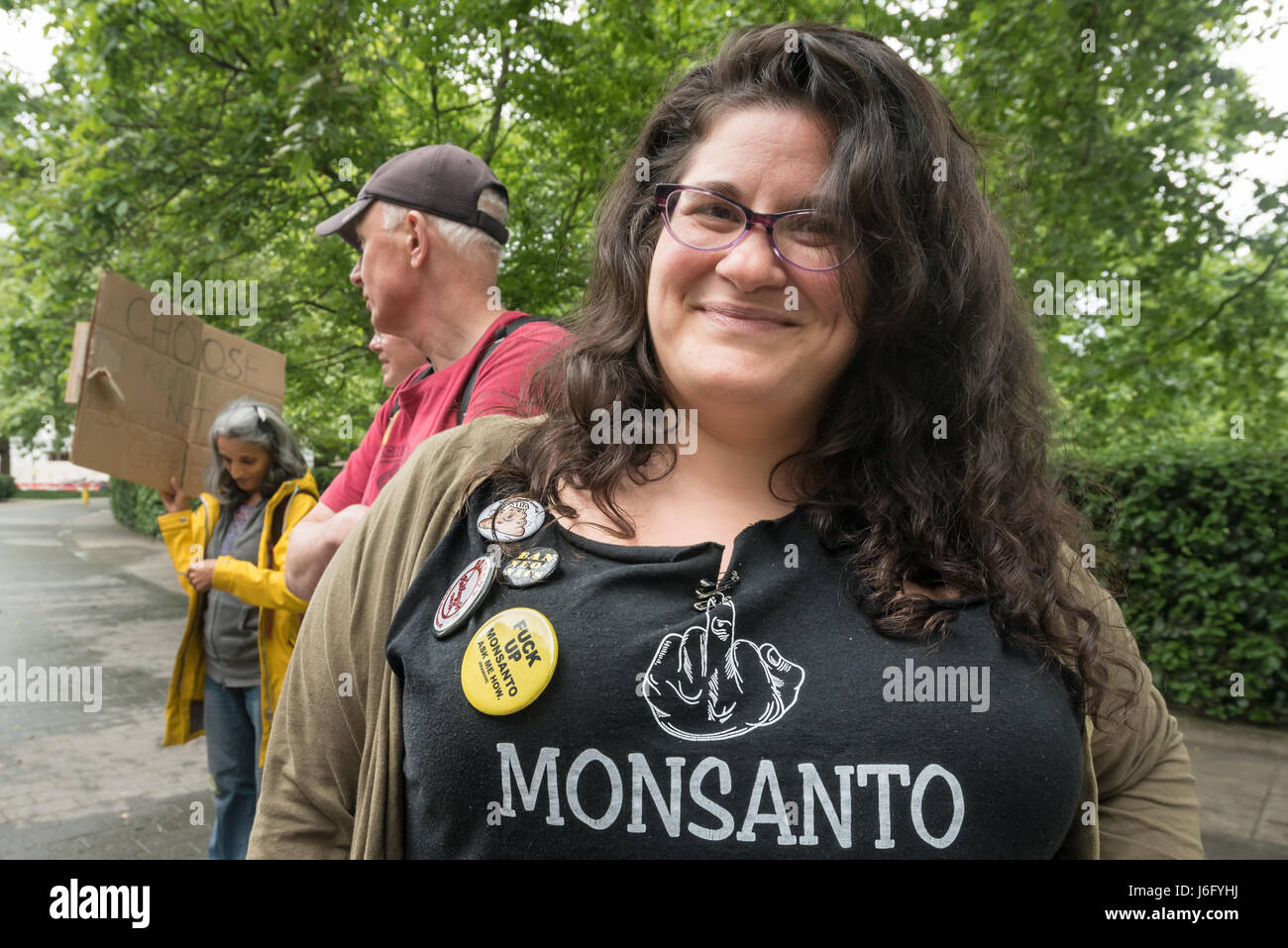 London, UK. 20th May 2017. A wman wears a t-shirt and badges fropm the ...