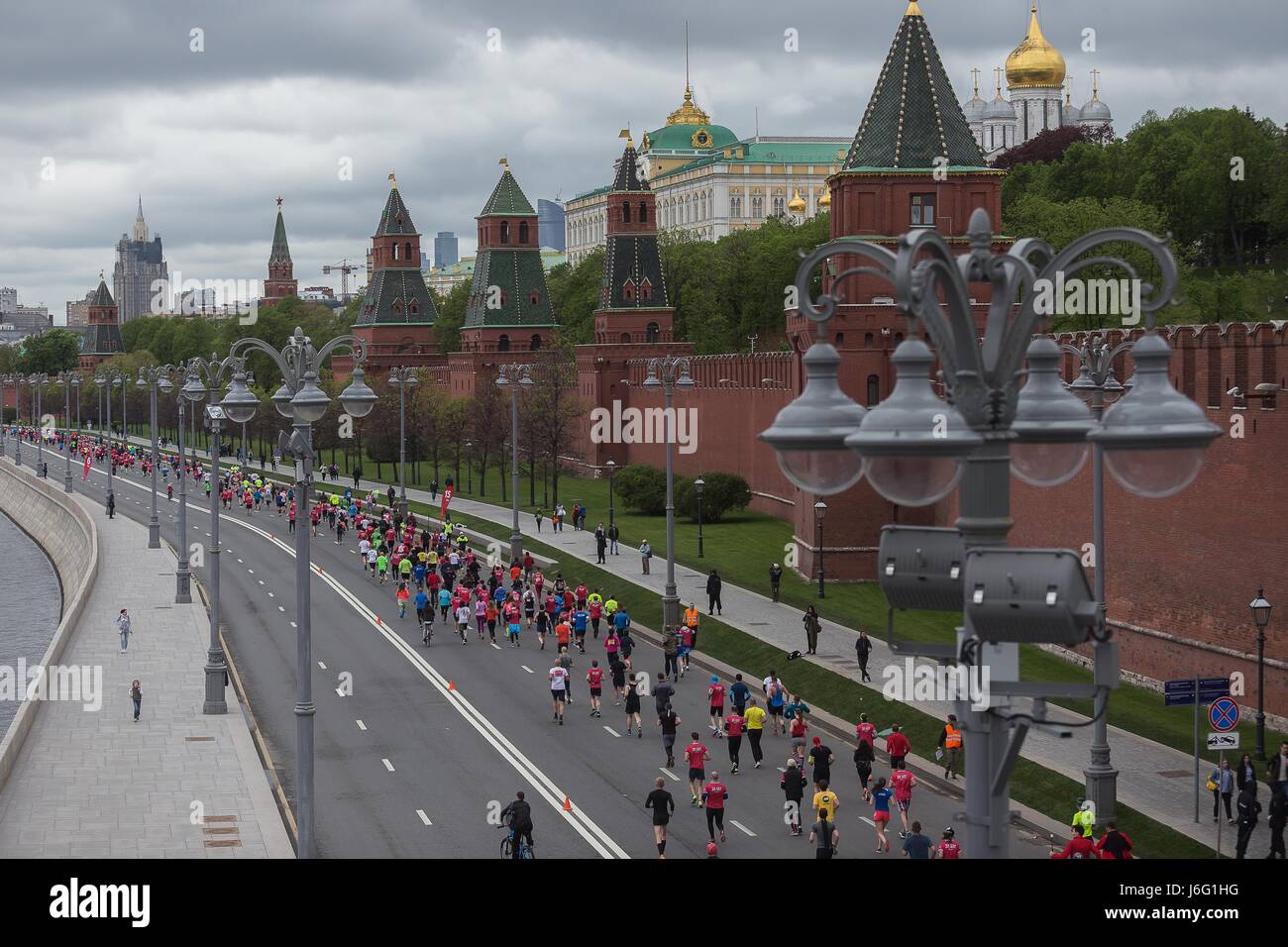 Moscow, Russia. 21st May, 2017. People run by Kremlin walls during the ...