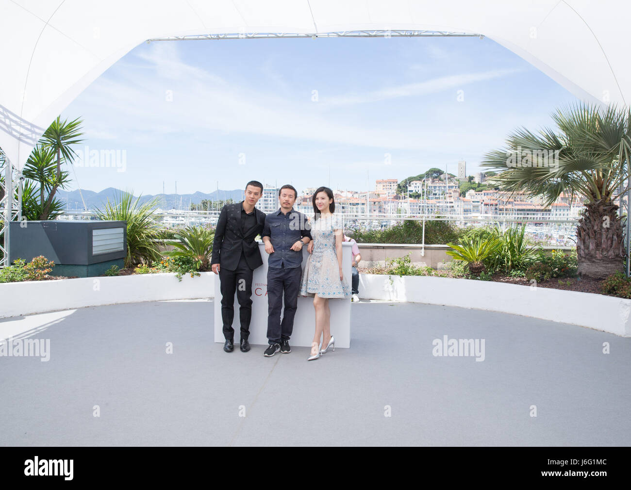 Cannes, France. 21st May, 2017. Chinese director Li Ruijun (C), actor ...