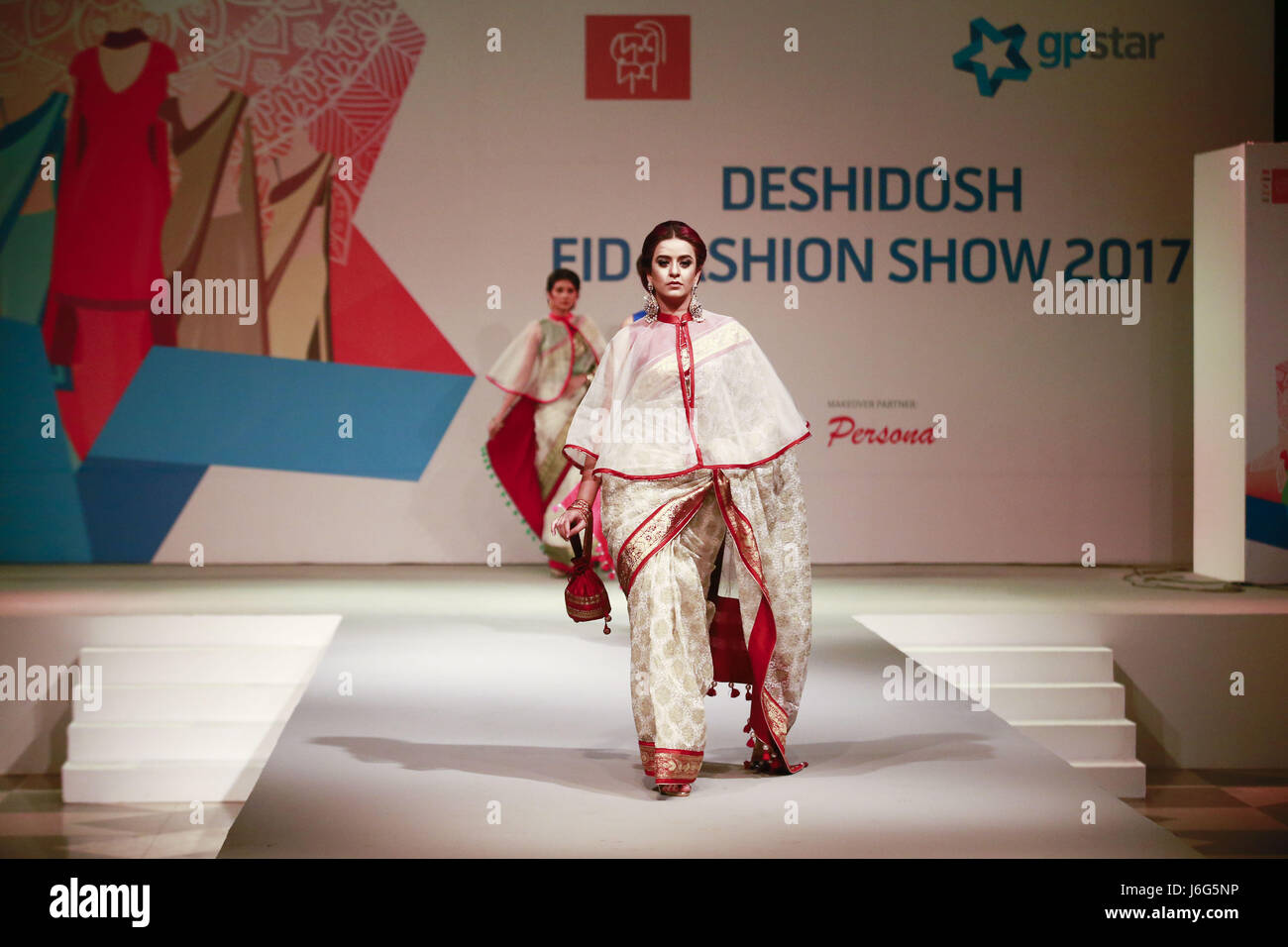 Dhaka, Bangladesh. 21st May, 2017. Bangladeshi models display cloths ...