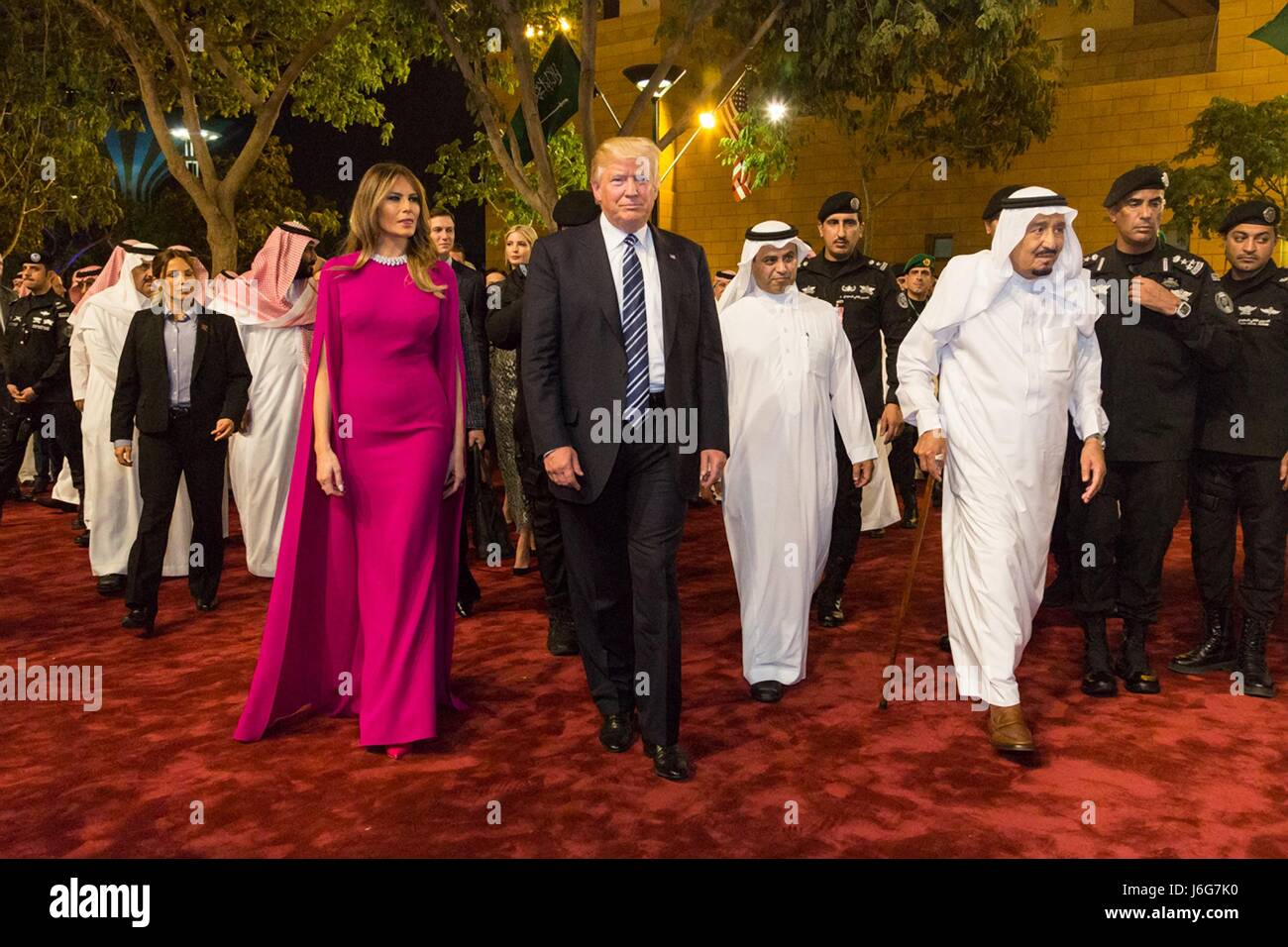U.S. President Donald Trump and First Lady Melania Trump are escorted ...
