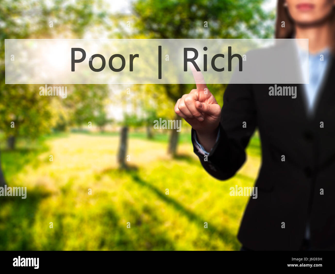 Poor Rich - Businesswoman hand pressing button on touch screen ...