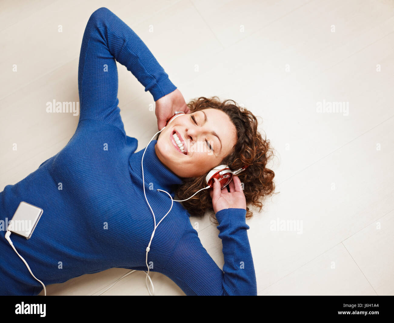 woman music earphones headphones listening woman blue humans human ...